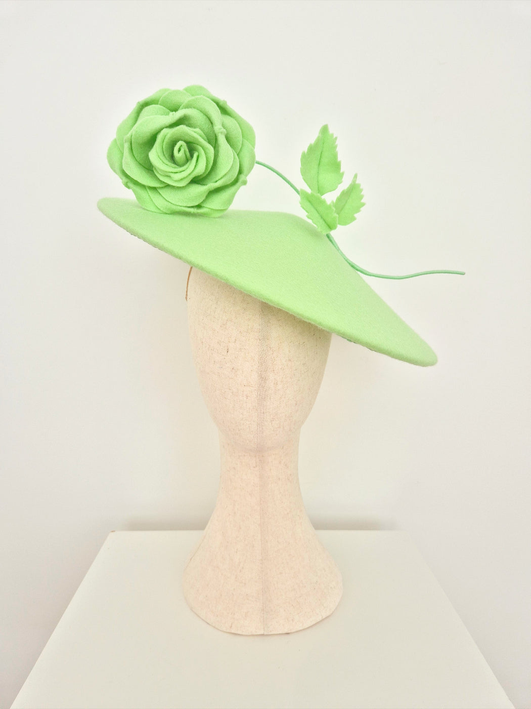 Miss Josephine. Pale mint green wool felt coolie hat with floating ros ...